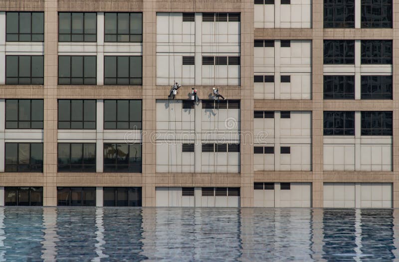 Group of Workers Cleaning Windows Service on High Rise Office Building ...