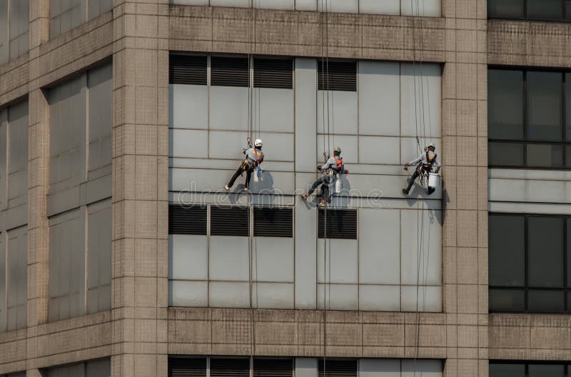Group of Workers Cleaning Windows Service on High Rise Office Building ...