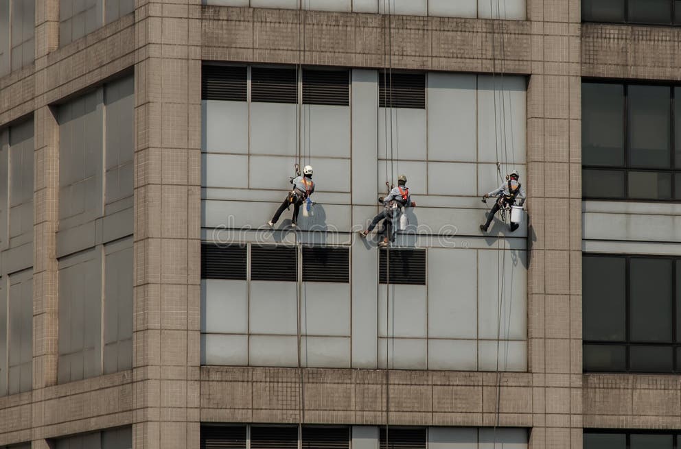 Group of Workers Cleaning Windows Service on High Rise Office Building ...