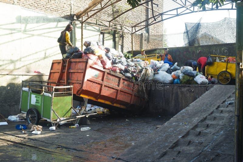 Waste Management Team Working Hard To Clear Trash in the City Editorial ...