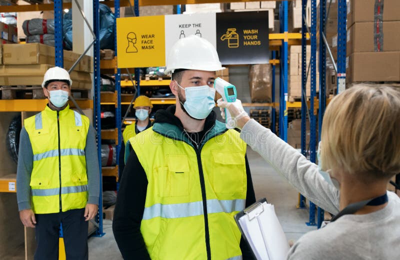 Group of Workers with Face Mask in Warehouse, Coronavirus and ...