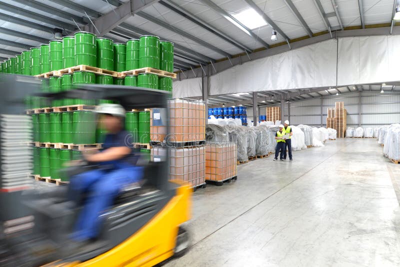 Group of Workers in the Logistics Industry Work in a Warehouse with ...