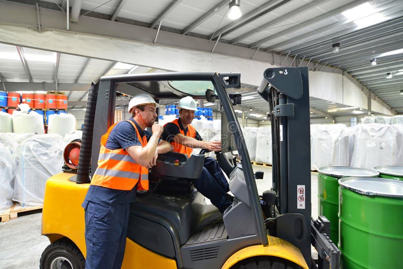 Group of Workers in the Logistics Industry Work in a Warehouse with ...