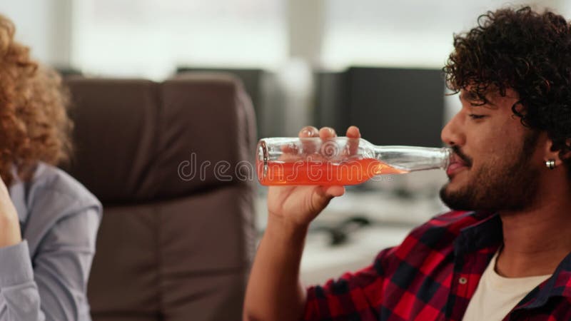 A Group of Workers Sitting in the Office Drinking Alcohol and Talking ...