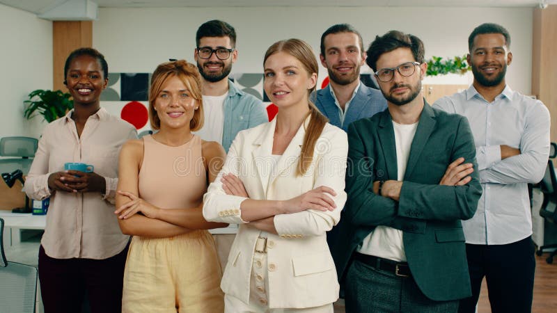 A Group of Workers are Staring Directly at the Camera while Having ...