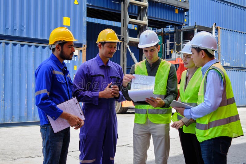 Group of Workers Teamwork at Logistics Terminal with Many Stacks of ...
