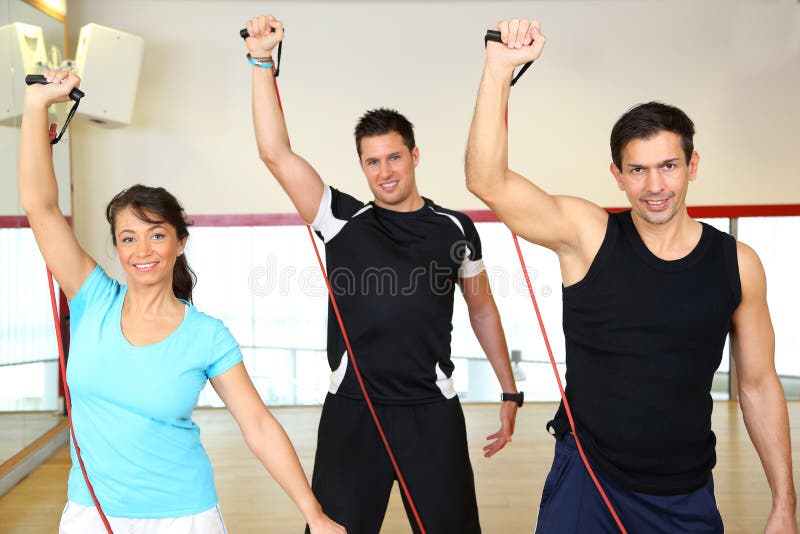 Group Working Out in a Gym Using Expanders Stock Photo - Image of ...