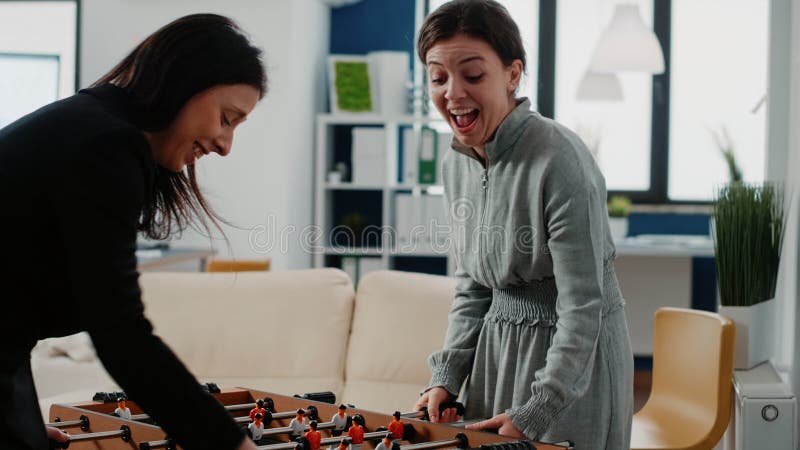 Group of Workmates Playing Game on Foosball Table Stock Image - Image ...
