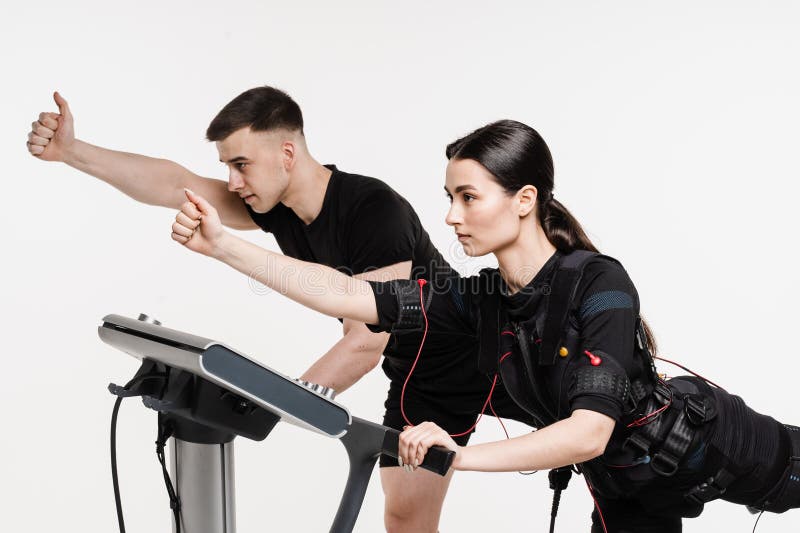Group Workout Training in EMS Suit, Which Applies Electrical Impulses ...