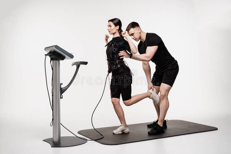 Group Workout Training in EMS Suit, Which Applies Electrical Impulses ...