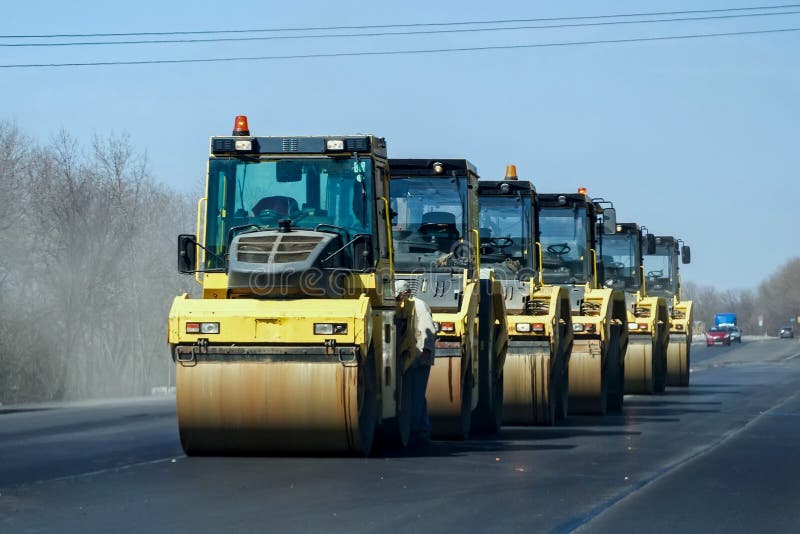 Group of Yellow Asphalt Compactors on Road Stock Photo - Image of ...