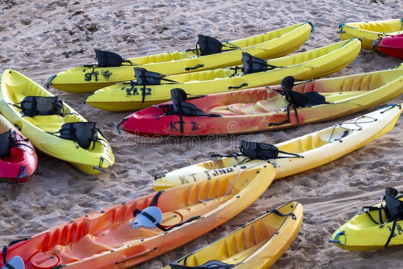 Group of yellow kayaks stock photo. Image of algarve - 237802936