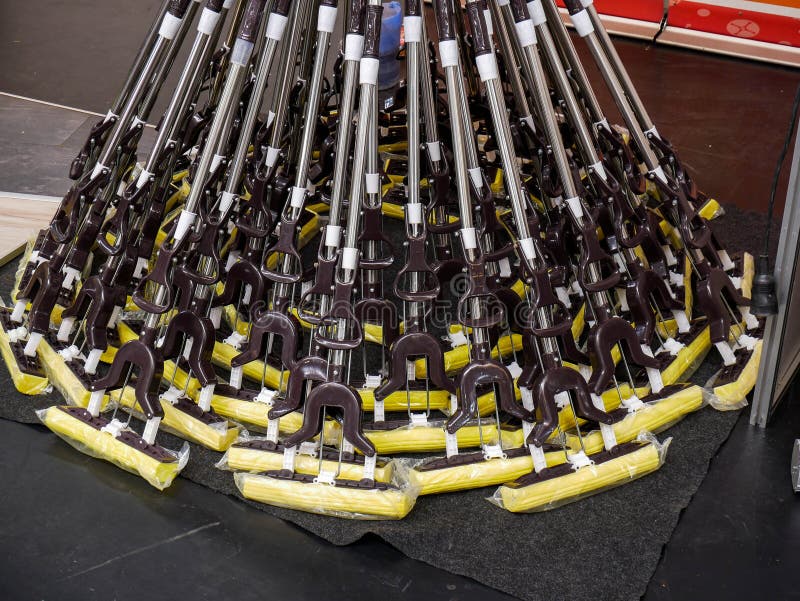 Group of Yellow Swabbing Mops Forming a Circle Stock Image - Image of ...