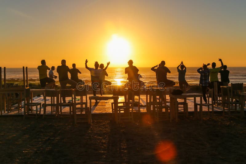 Group Make Yoga Exercises on the Beach at Sunset Editorial Stock Image ...