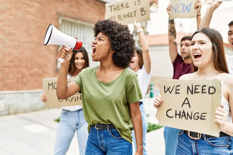 Group of Young Activists People Protesting Holding Banner and Using ...