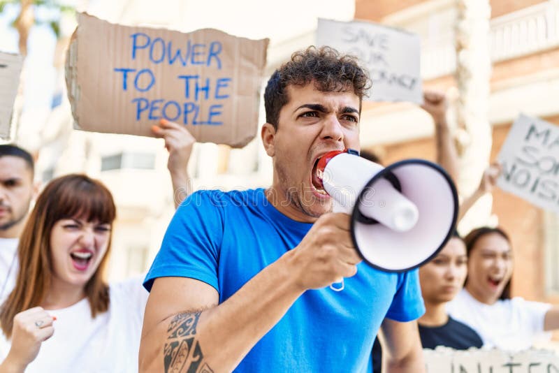 Group of Young Activists Protesting Holding Banner and Using Megaphone ...