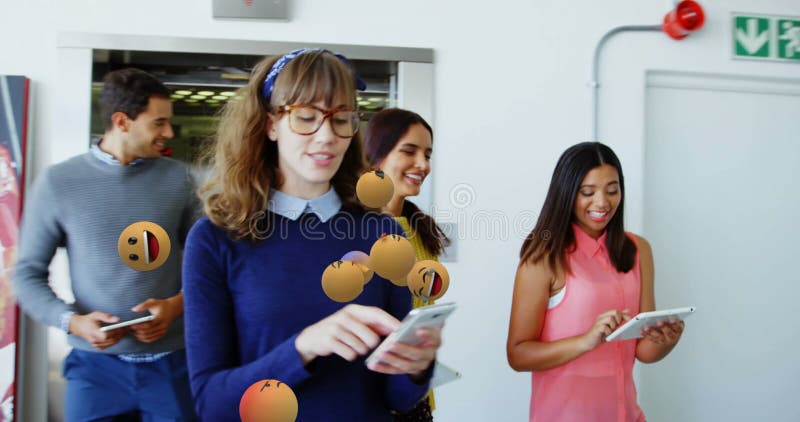 Group of Young Adults Using Smartphones and Tablets, Walking in Office ...