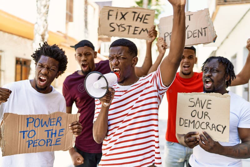 Group of Young African American Activists Protesting Holding Banner and ...