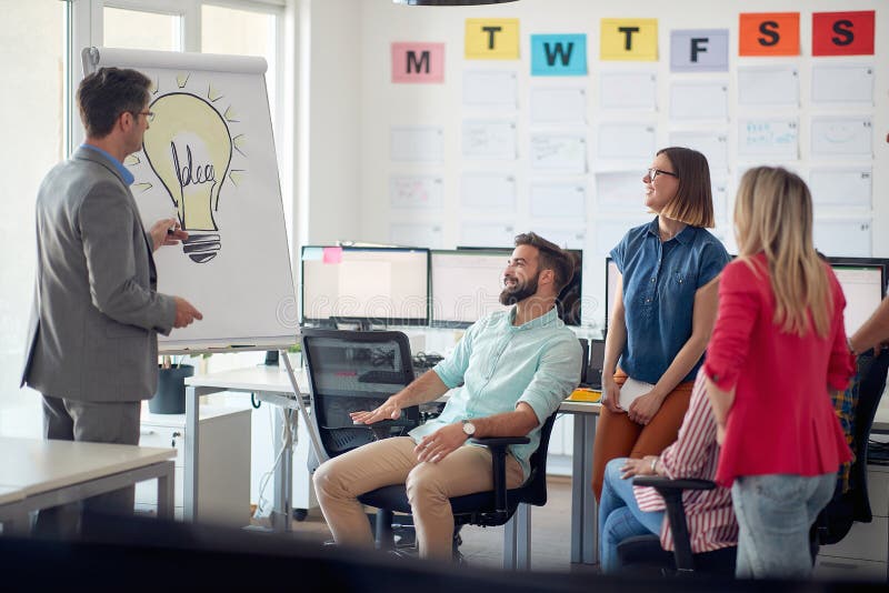 Group of Young Ambitious Employees Brainstorming Together Stock Image ...