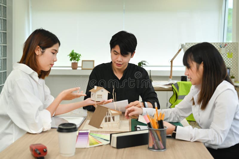 Group of Young Architect Brainstorming, Working Together on ...