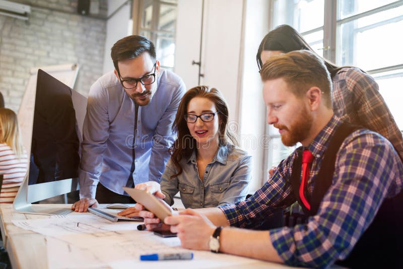 Group of Young Architects Using Digital Tablet Stock Image - Image of ...