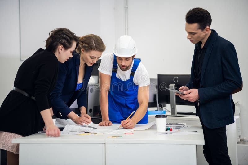 A Group of Young Architects Working on a Project. Cooperation an Stock ...