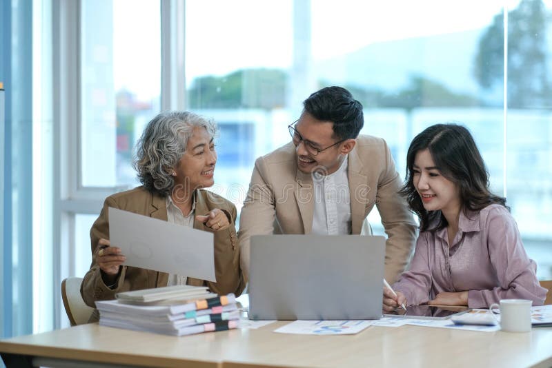 Group of Young Asian Business People Brainstorm Collaboration Ideas at ...