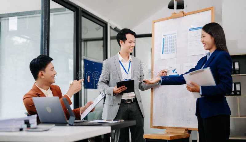 Group of Young Asian Business People Discussing Business Plan at Modern ...