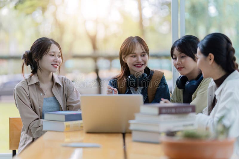 Group of Young Asian College Students Sitting on a Bench in a Campus ...