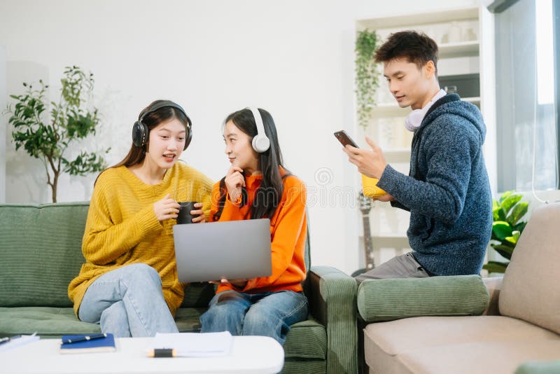 Group of Young Asian College Students Working on His Project Assignment ...