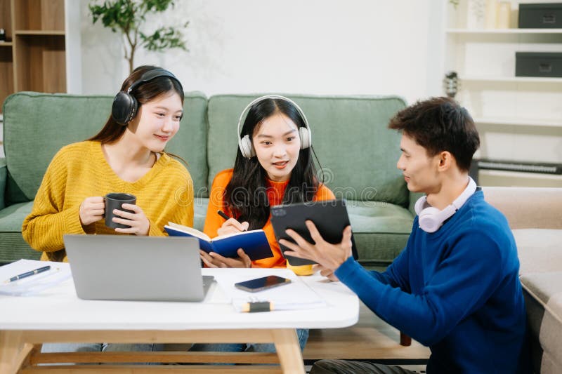 Group of Young Asian College Students Working on His Project Assignment ...