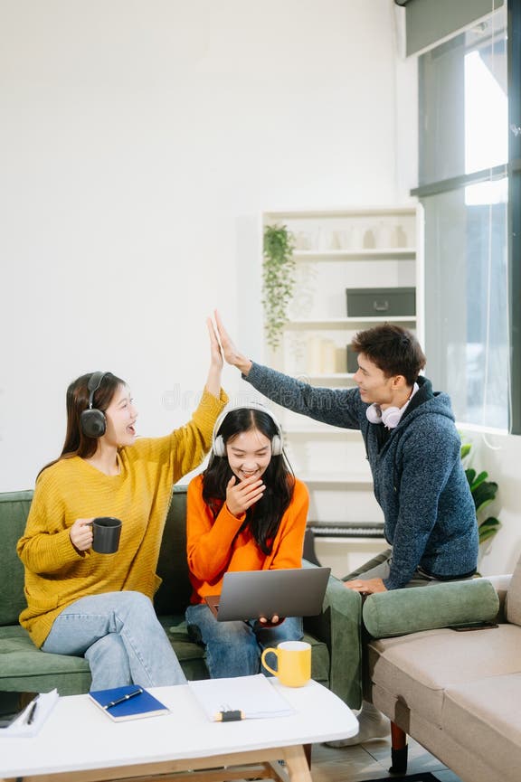 Group of Young Asian College Students Working on His Project Assignment ...