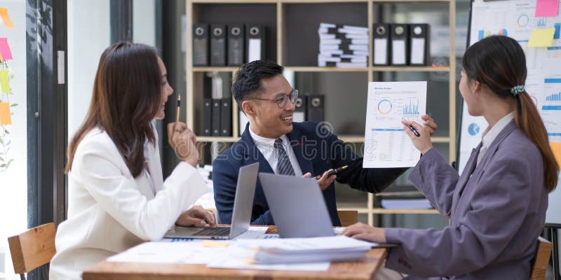 Group of Young Asian Modern People in Smart Casual Wear Having a ... Group of Young Asian Modern People in Smart Casual Wear Having a ...