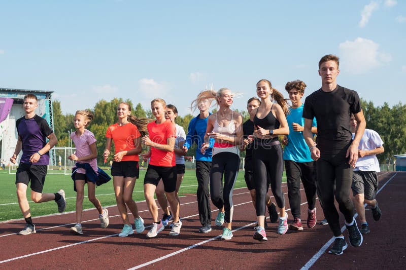 Group of Young Athletes Training at the Stadium Stock Image - Image of ...