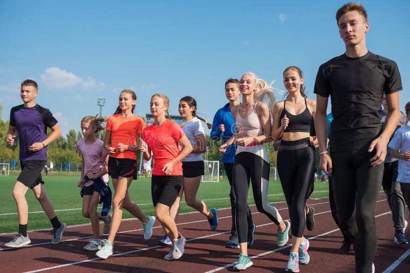 Group of Young Athletes Training at the Stadium Stock Image - Image of ...