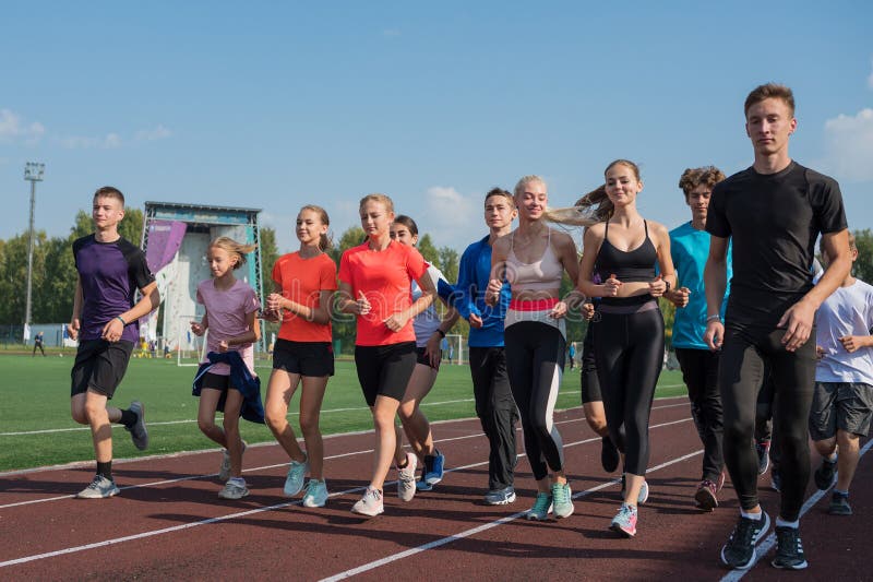 Group of Young Athletes Training at the Stadium Stock Photo - Image of ...