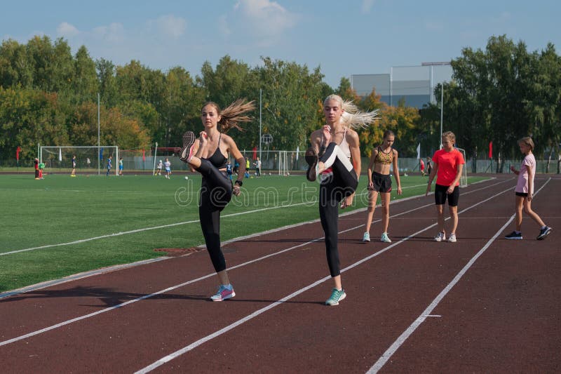 Group of Young Athletes Training at the Stadium Stock Image - Image of ...