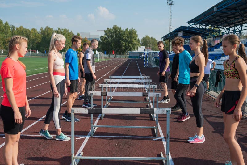 Group of Young Athletes Training at the Stadium Stock Image - Image of ...