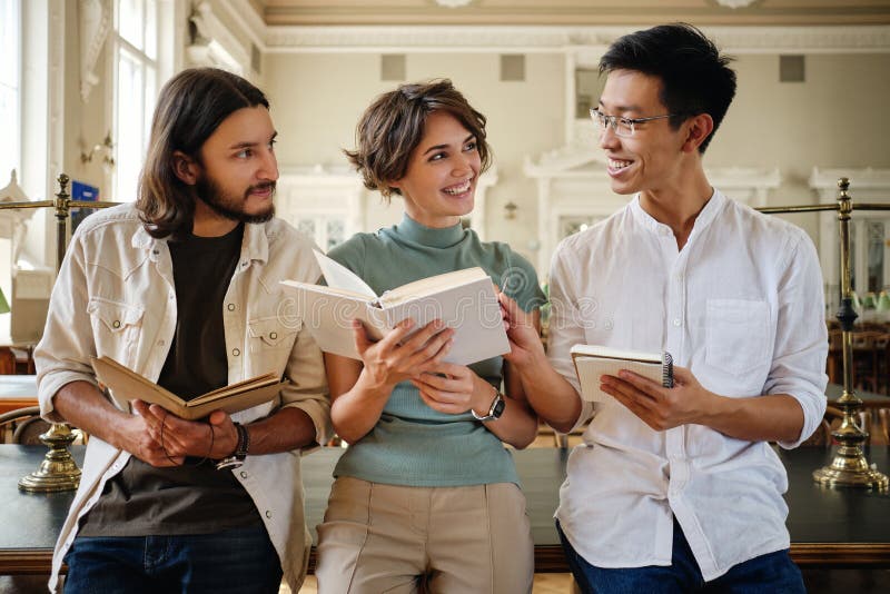 Group of Young Attractive Multinational Students Happily Studying in ...