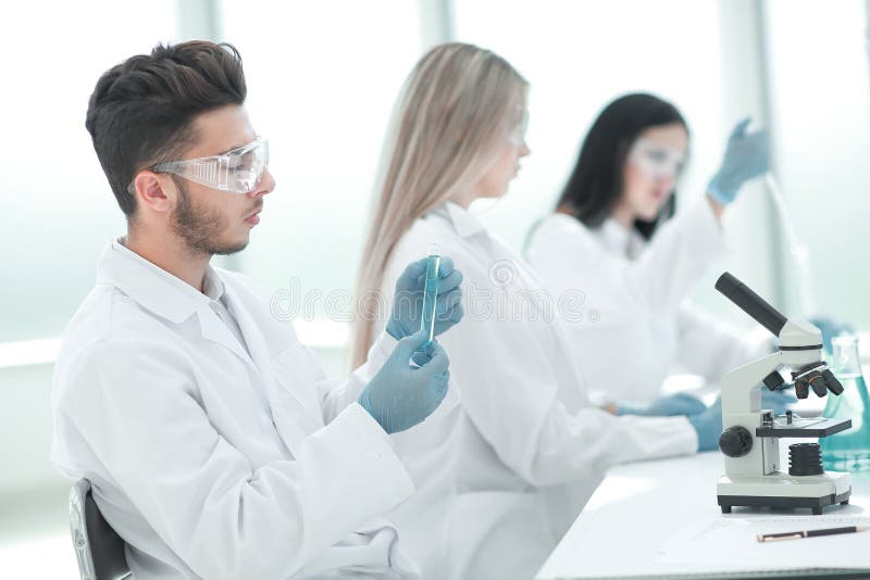 Group of Young Biologists Sitting at the Laboratory Table Stock Photo ...