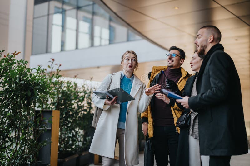 Group of Young Business Entrepreneurs Discussing Ideas in an Office ...