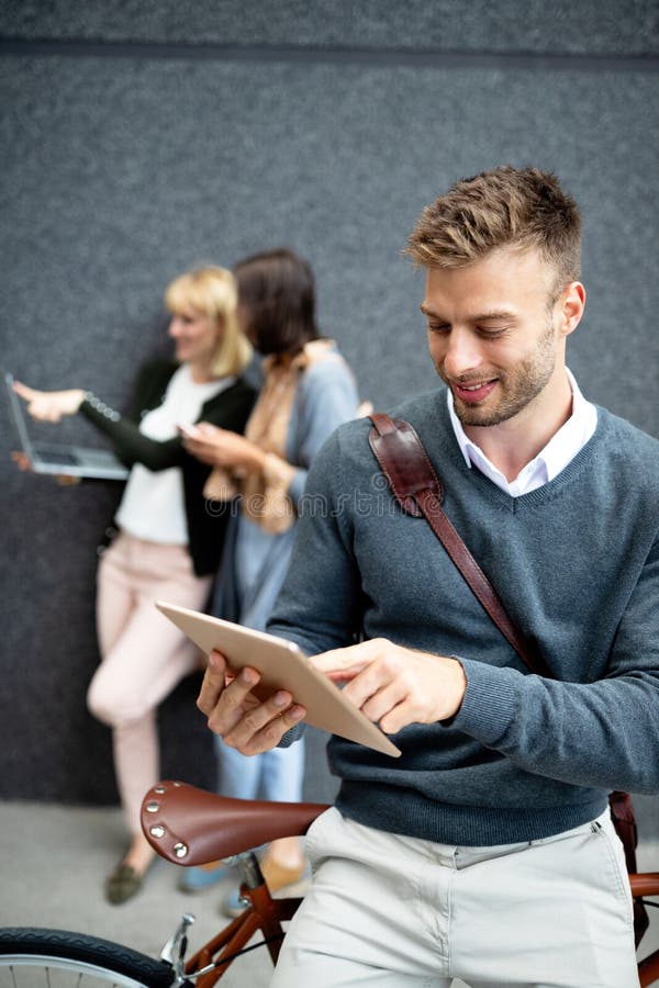 Group of Young Business People Holding Different Digital Devices ...