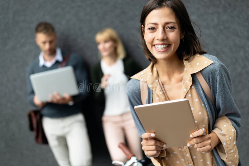 Group of Young Business People Holding Different Digital Devices ...