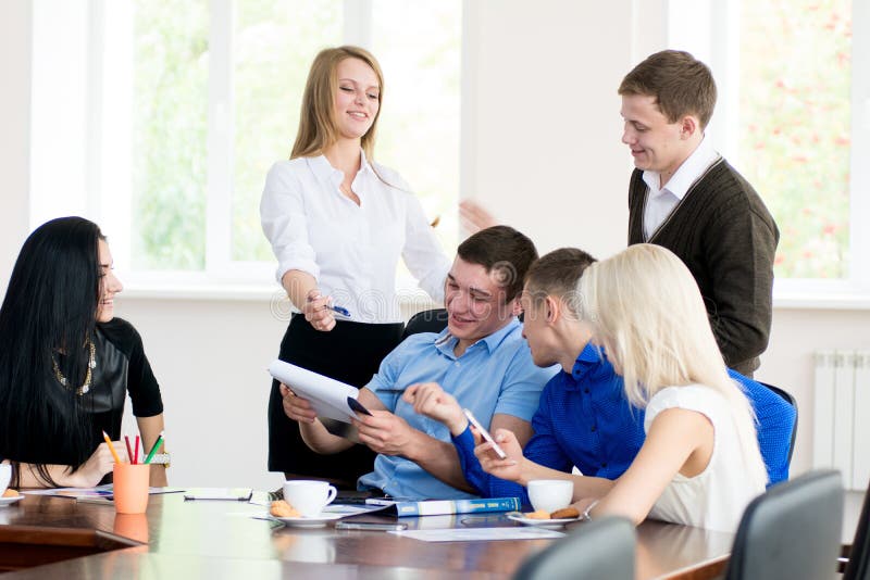 A Group of Young Business People in the Office Having Fun Discus Stock ...