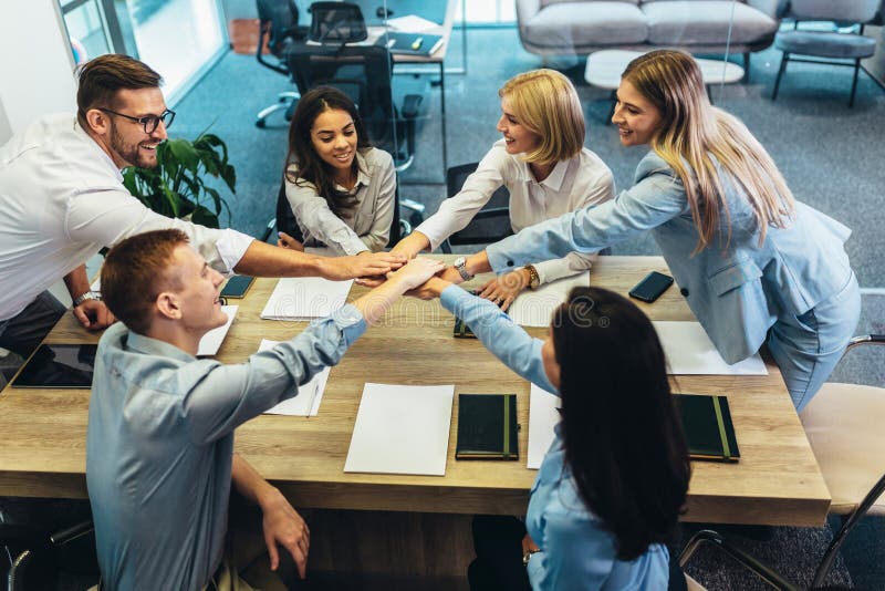 Young Business People Showing Their Unity Stock Photo - Image of office ...