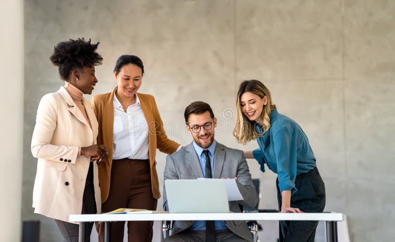 Group of Young Business People Working As a Team and Communicating in ...