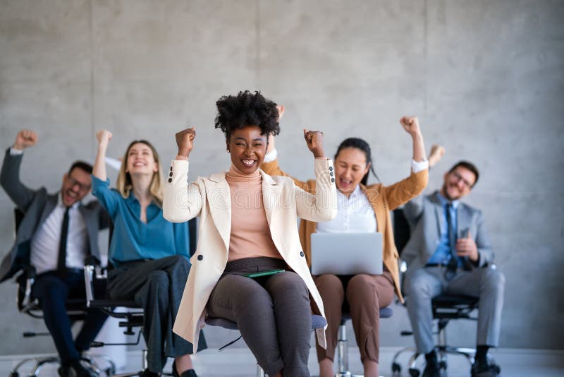 Group of Young Business People Working As a Team and Communicating in ...
