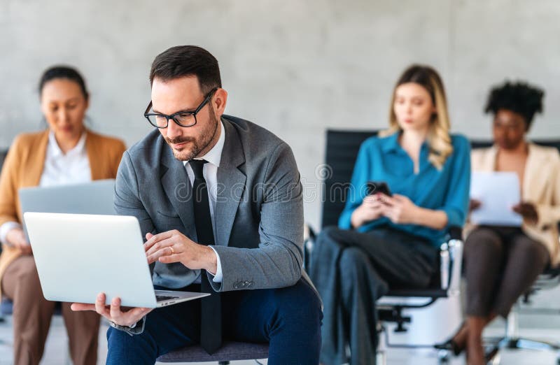 Group of Young Business People Working As a Team and Communicating in ...