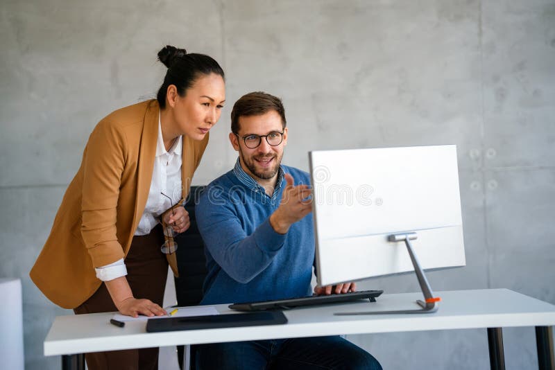 Group of Young Business People Working As a Team and Communicating in ...