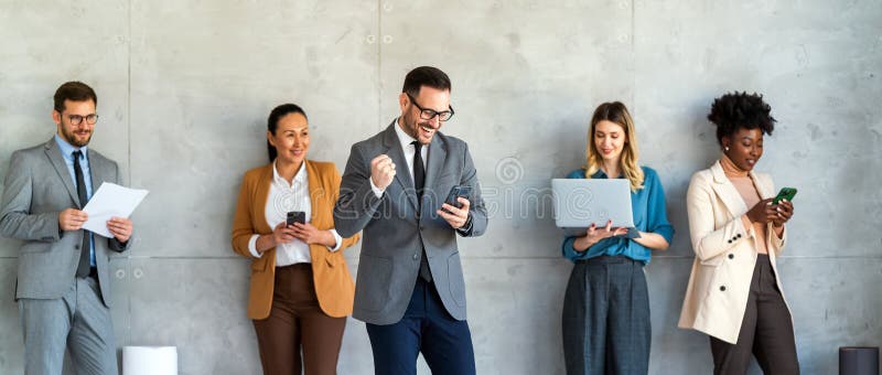 Group of Young Business People Working As a Team and Communicating in ...